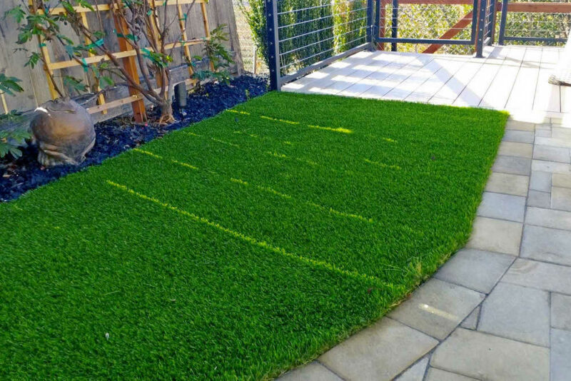 How to Transform Backyard Patios with Durable Concrete Pavers and Turf