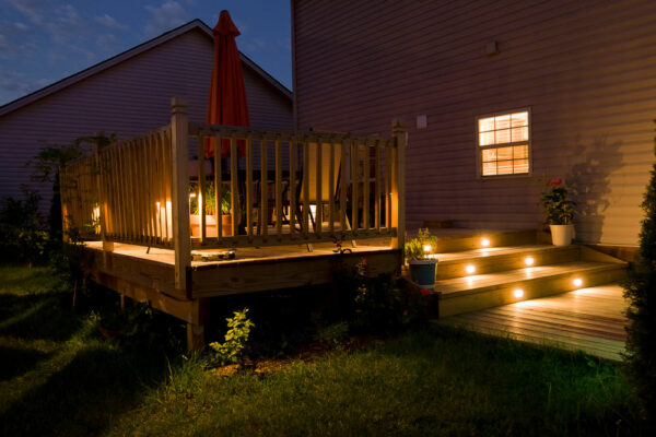 Why Integrating Deck Lighting into Railings Improves Ambiance and Safety